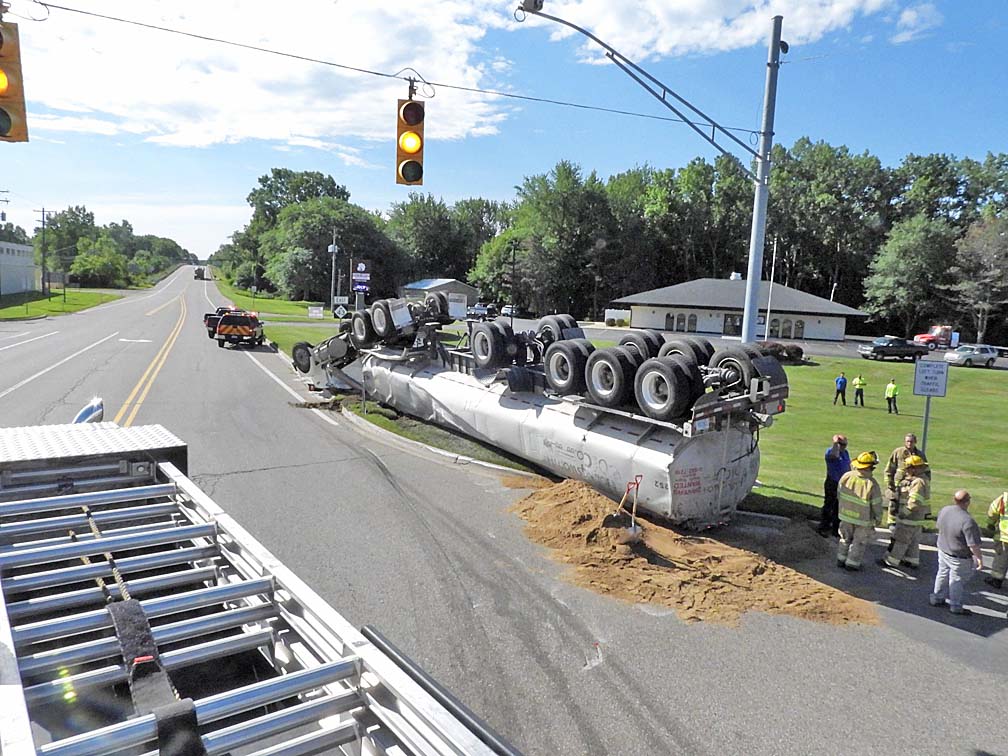 Fecal fiasco: Tractor-trailer loaded with human feces rolls over in ...
