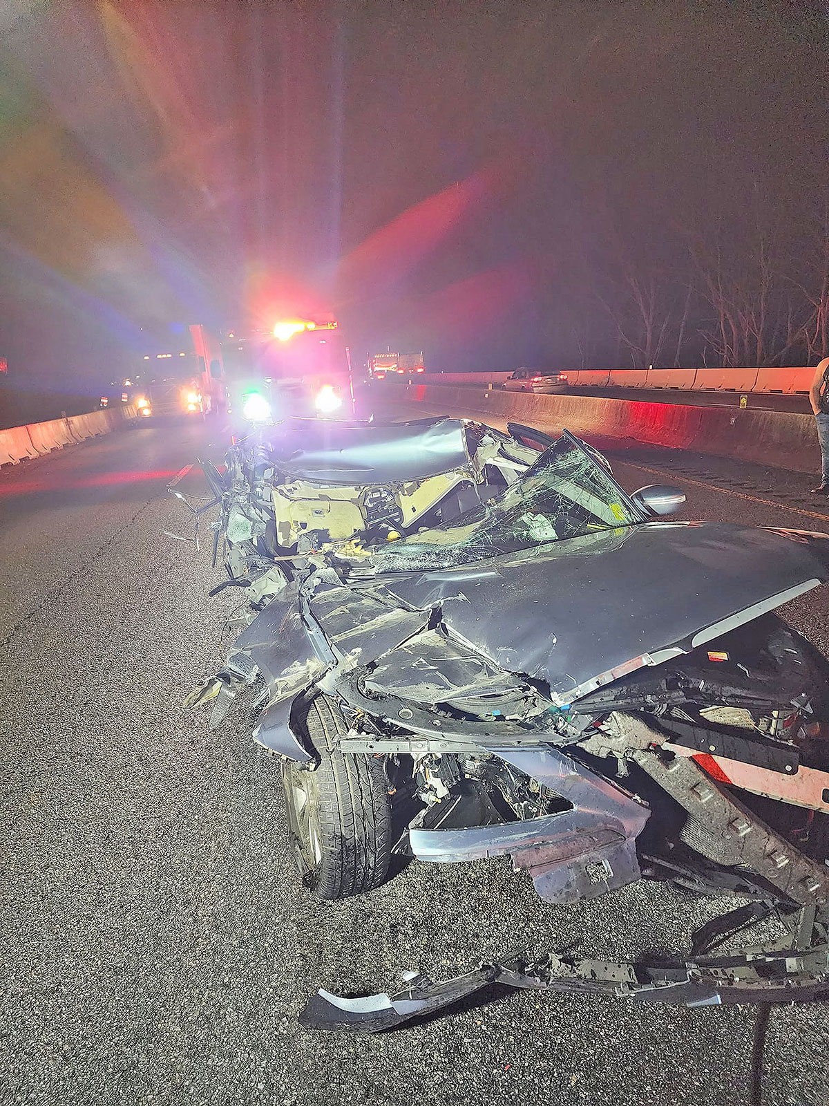 Driver walks away after vehicle flattened by tractor-trailer ...