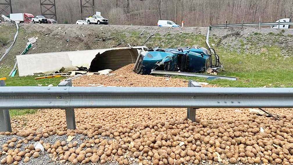 Big rig rolls, spilling load of potatoes in West Virginia - TheTrucker.com