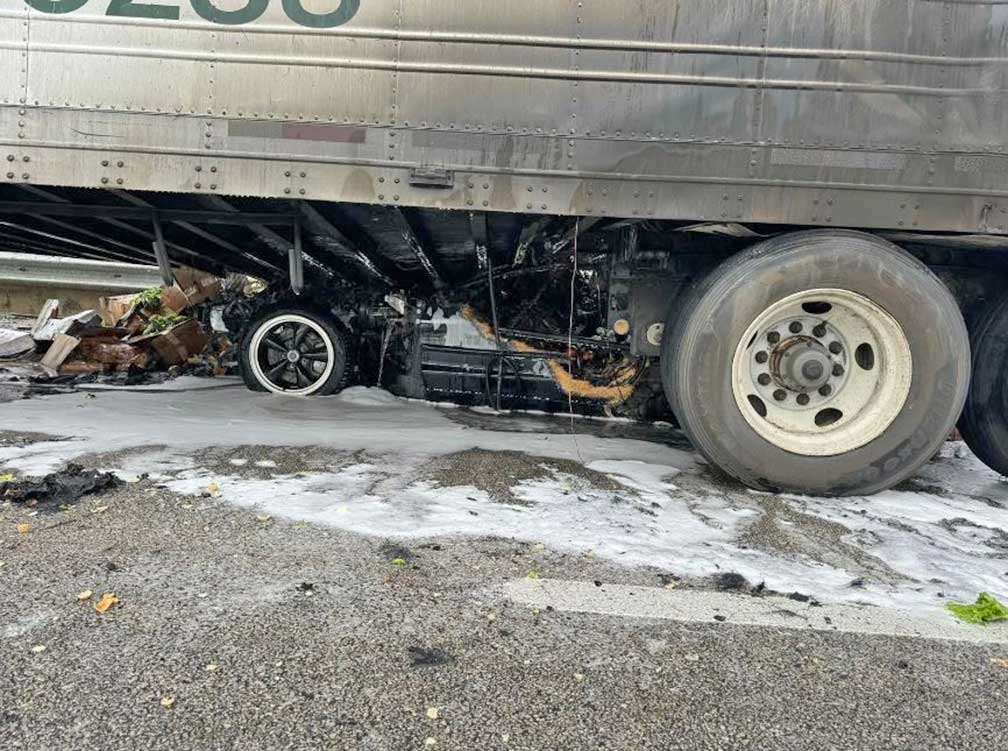 Passenger car destroyed after crashing under semi's trailer ...