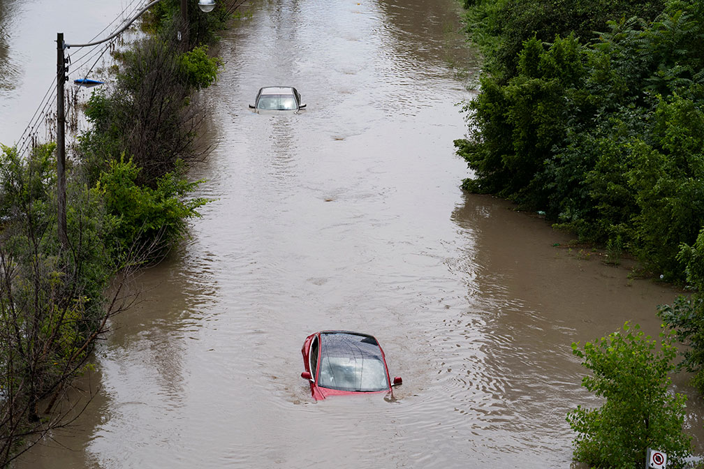 Storms flood the Ozarks and strand drivers in Toronto; tornado moves a ...