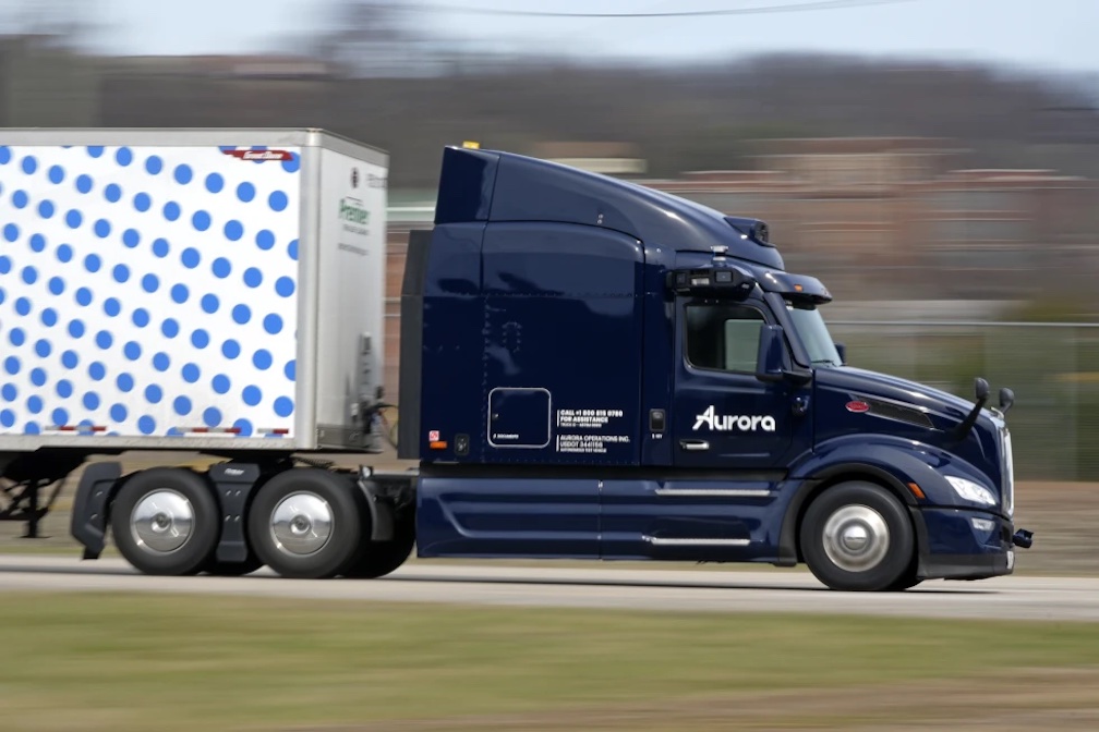 Autonomous truck company Aurora delays hauling freight without human drivers until April ...